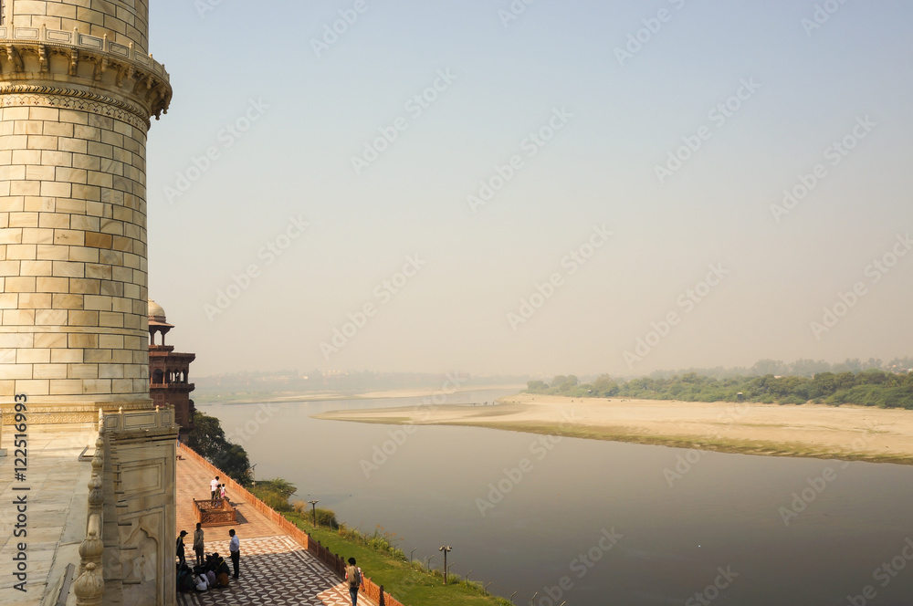 The Taj Mahal along the rear riverbank of the holy Jamuna river in Agra ...
