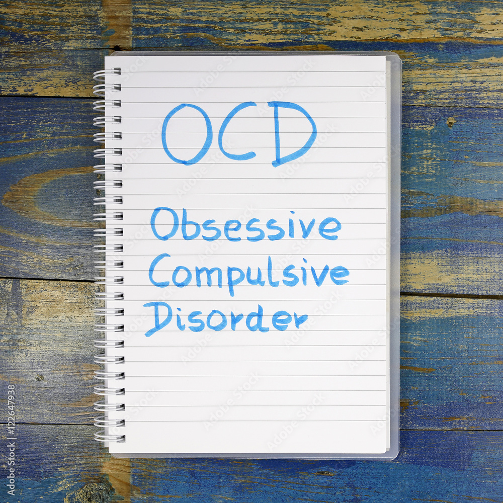 OCD - Obsessive Compulsive Disorder written in notebook on wooden ...