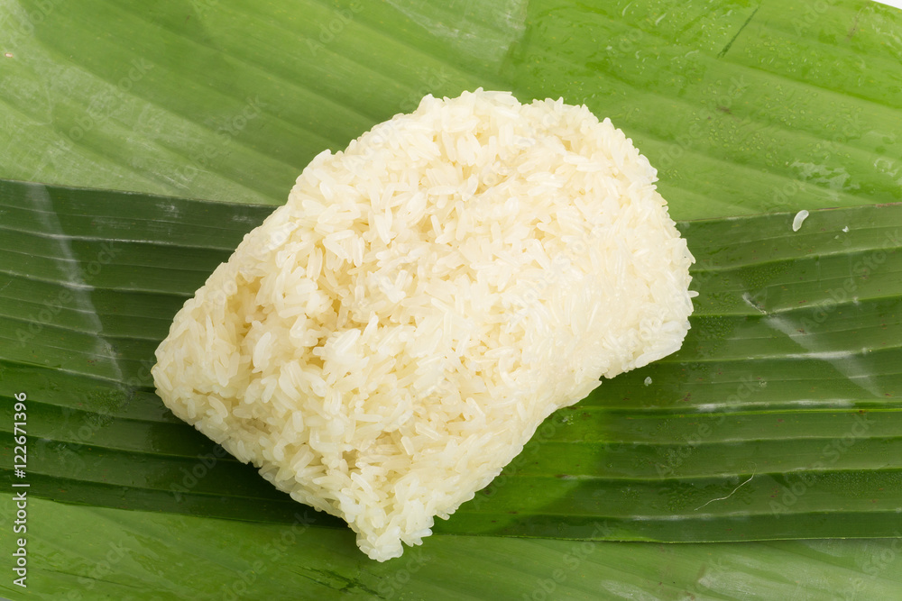 Sticky rice wrapped in banana leaf. Stock Photo | Adobe Stock