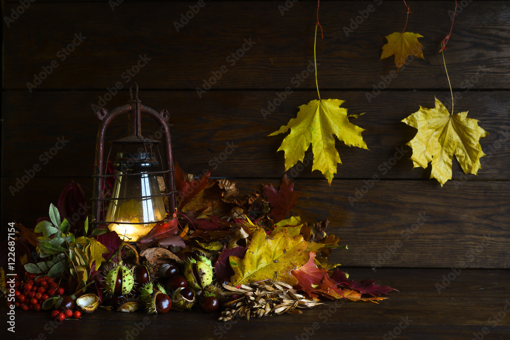 Fall mood with antiques kerosene lamp . Still life of multi-colored ...