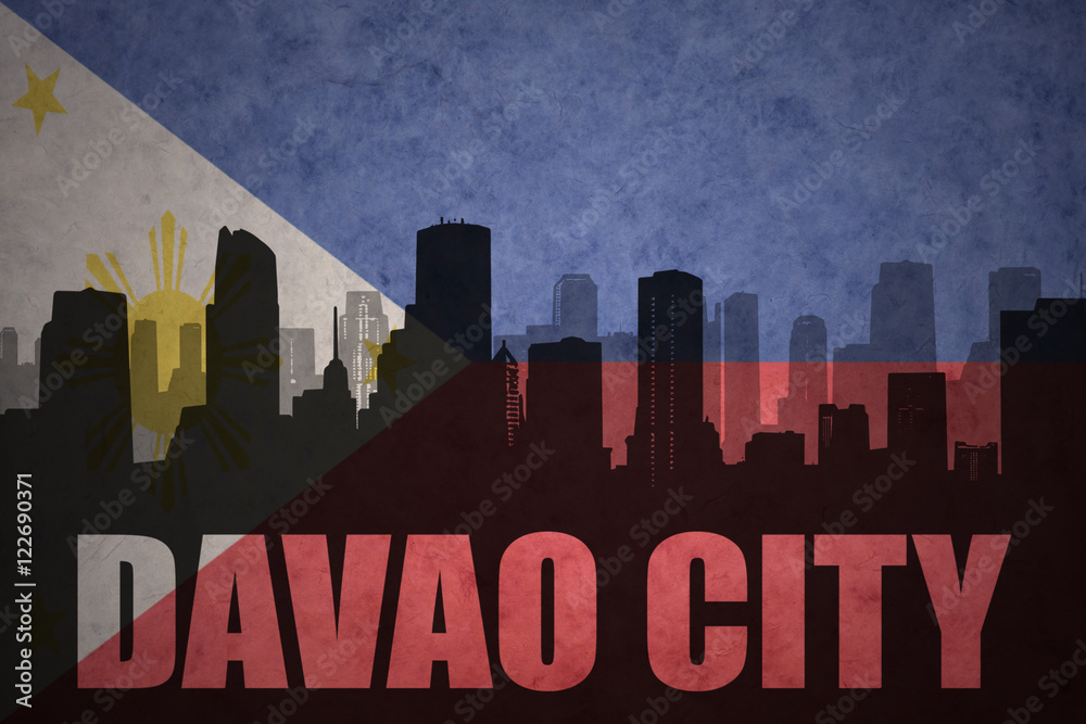 abstract silhouette of the city with text Davao City at the vintage ...