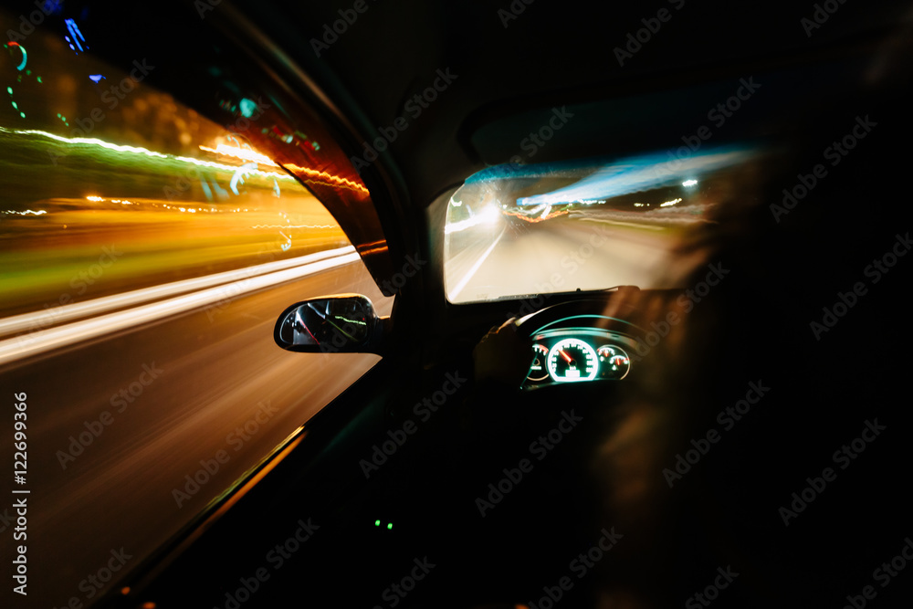 Driving at night. View from inside the car. Photo with a long exposure ...