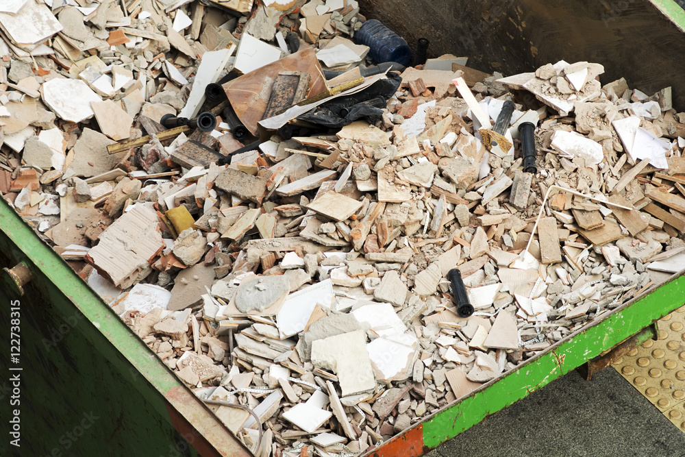rubble dumpster container with garbage bricks, pile of debris and ...