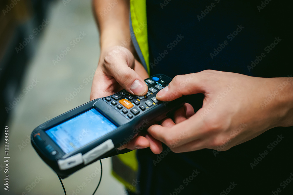 Worker Checking and Scanning Package by tablet handheld In Warehouse ...