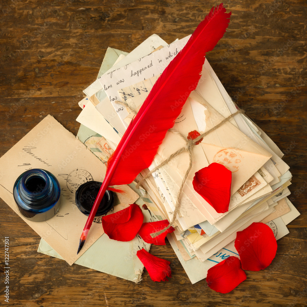 Bundle of letters and red rose petals Stock Photo | Adobe Stock