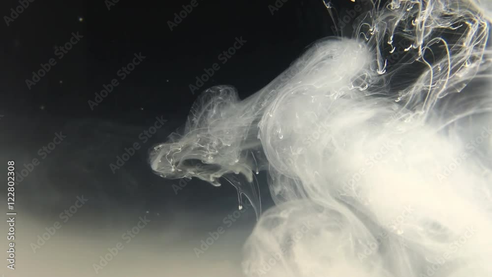 White Ink Effect In Water Filmed On Black Background. Abstract ink ...