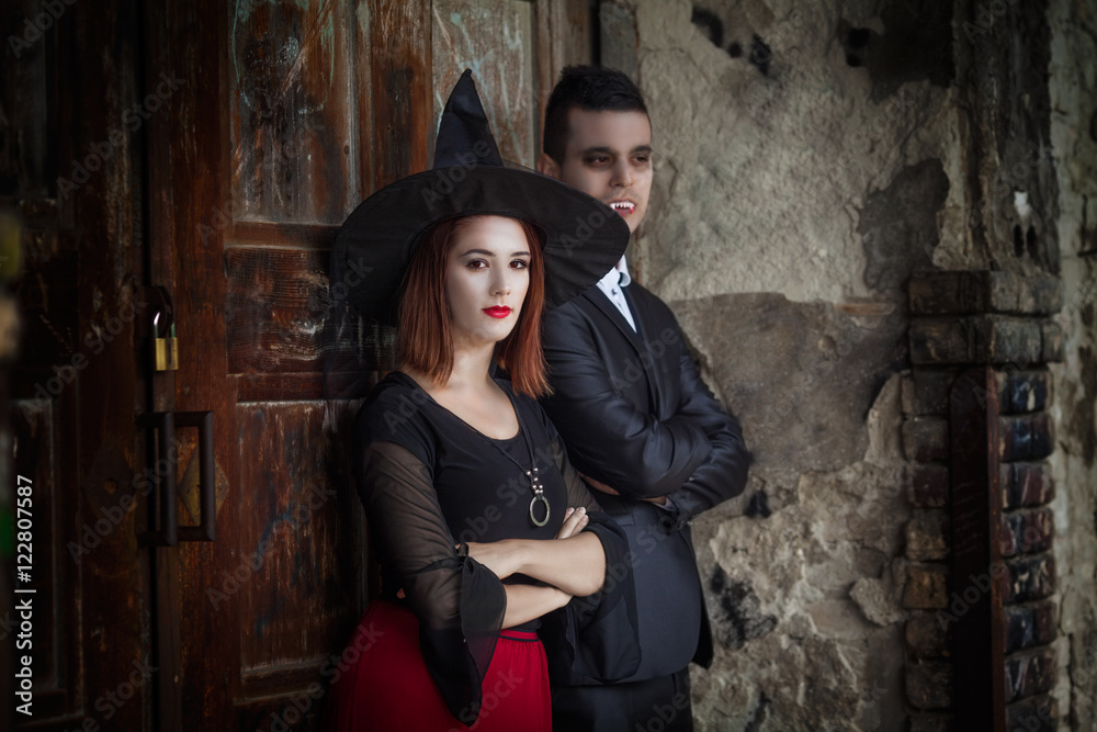 Vampire and the Witch are standing in front of the door of the haunted ...