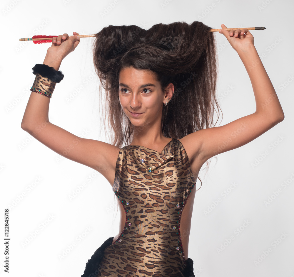 Girl in leopard print costume holding arrow Stock Photo | Adobe Stock