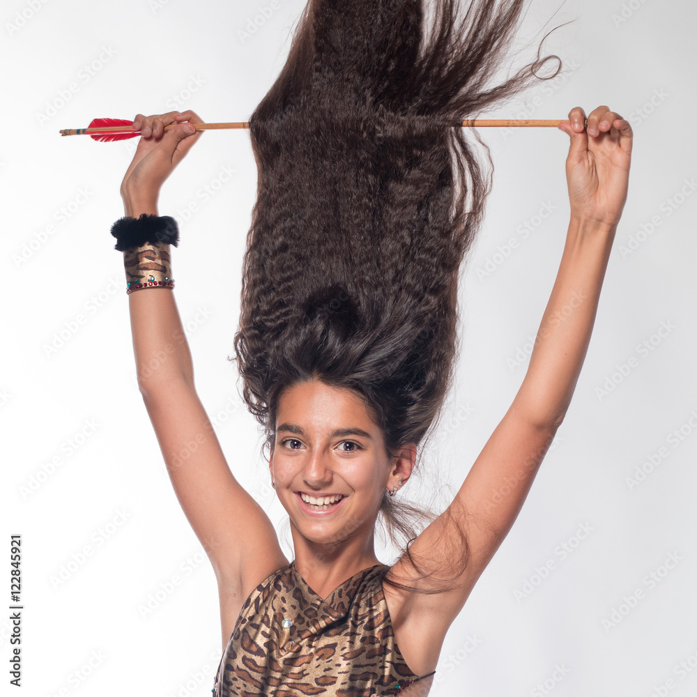 Girl in leopard print costume holding arrow Stock Photo | Adobe Stock