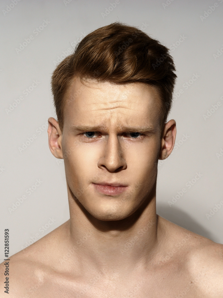 Studio fashion style portrait of young calm handsome red hair man ...