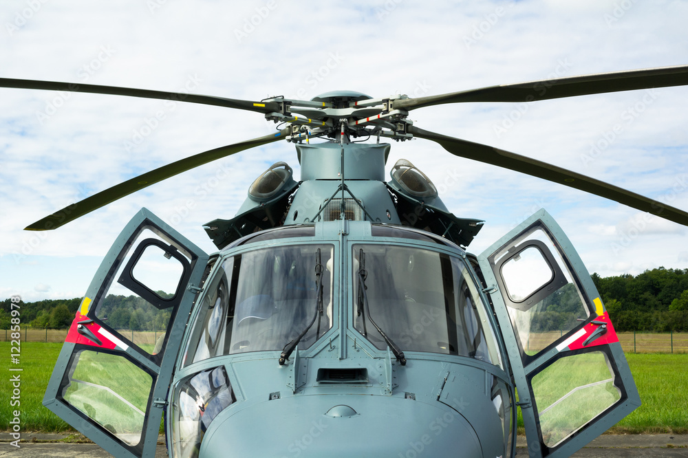 Modern grey helicopter front frontal side. Doors into cockpit of ...