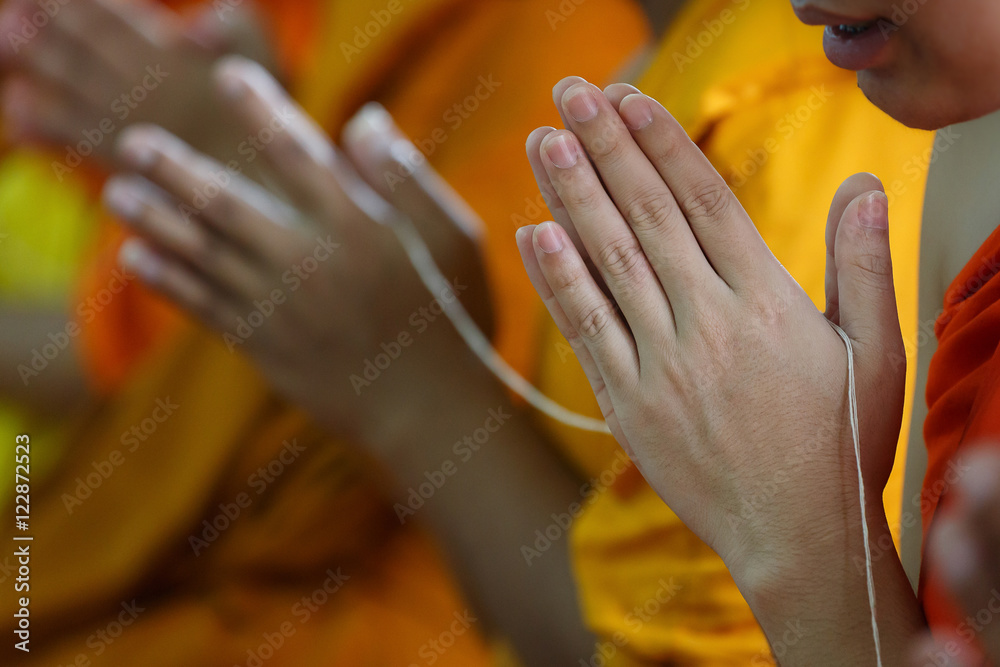 Buddhist monks praying hands Stock Photo | Adobe Stock