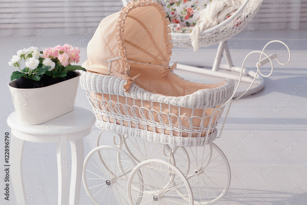 Vintage toy carriage in white interior. childhood Stock Photo | Adobe Stock
