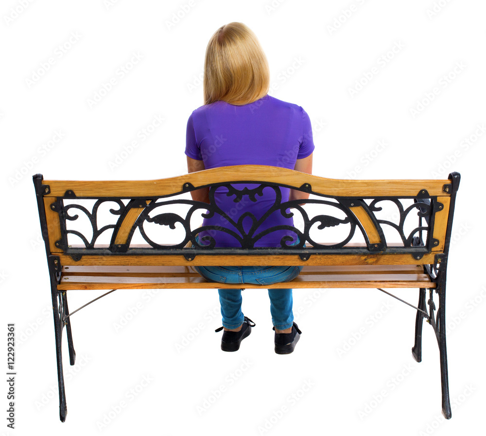 Back view of a woman sitting on a bench. girl watching. Rear view ...