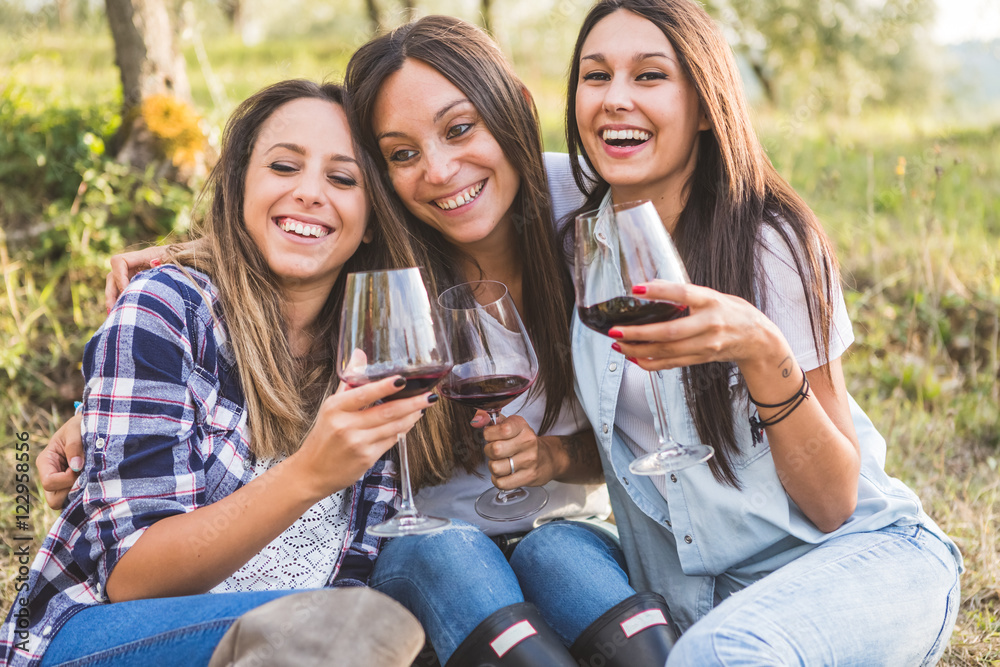 Girls drinking wine in the garden Stock Photo | Adobe Stock