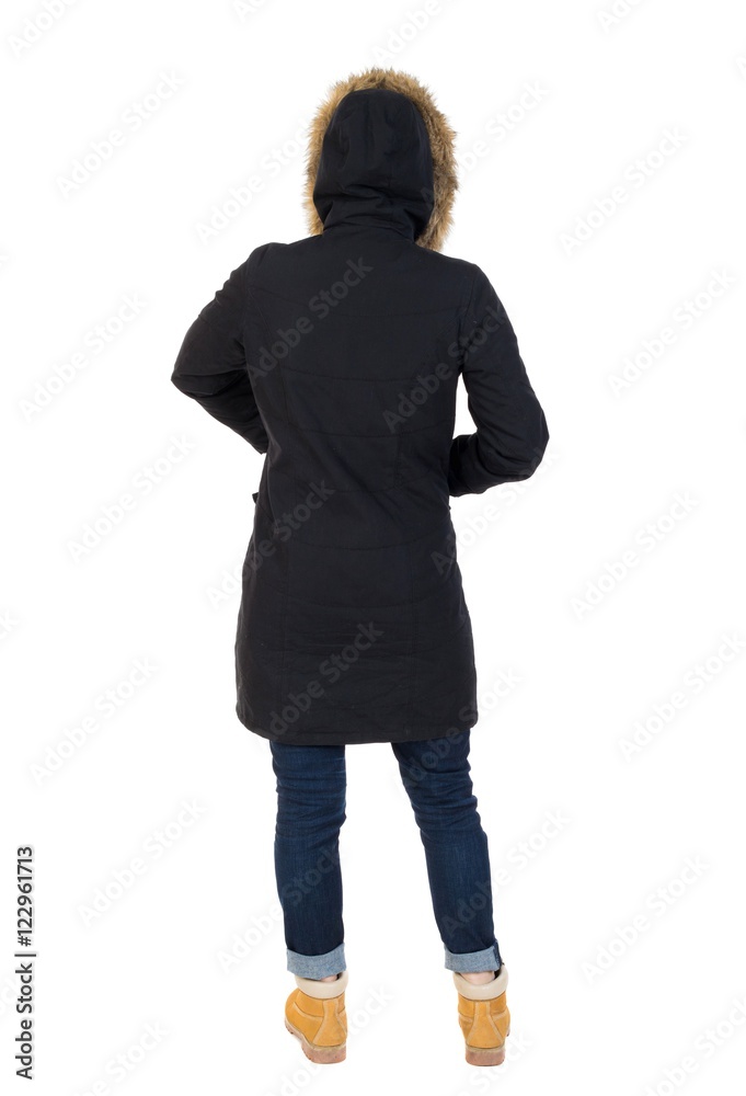 Back view woman in winter jacket looking up. Standing young girl in ...
