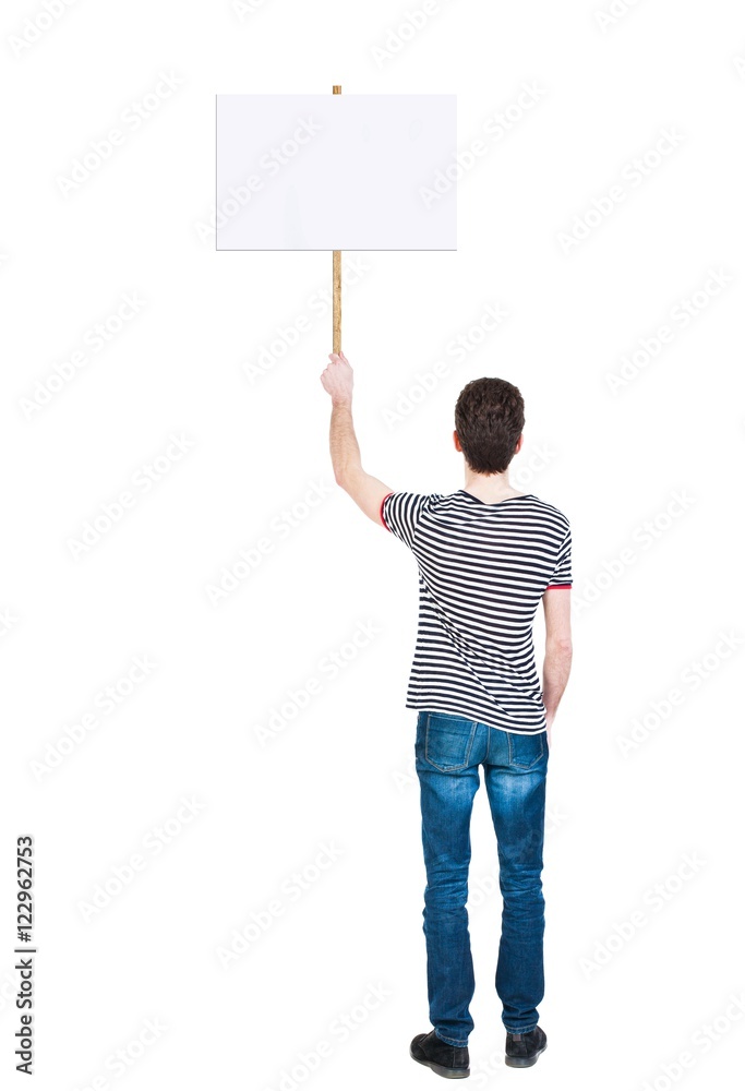 Back view man showing sign board. man holds information plate. Rear ...