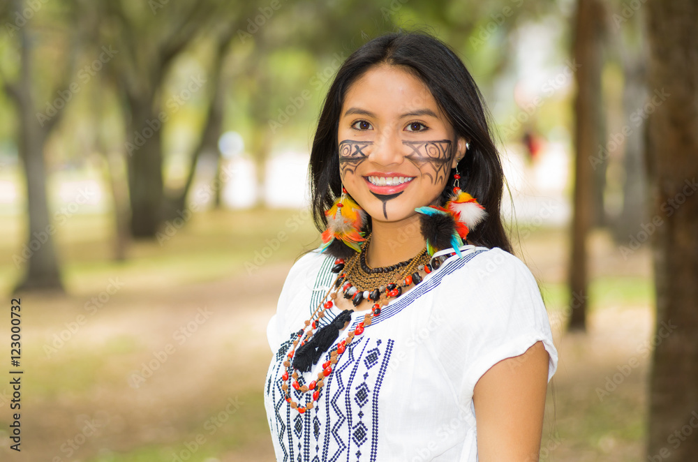 Beautiful Amazonian woman with indigenous facial paint and white ...