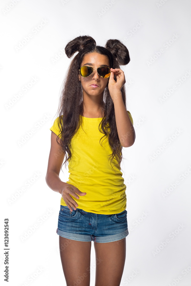 Emotional young brunette girl with long hair in yellow shirt and ...