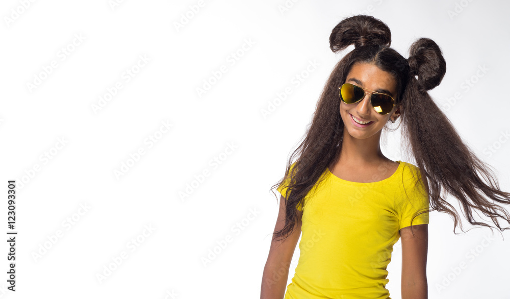 Emotional young brunette girl with long hair in yellow shirt and ...