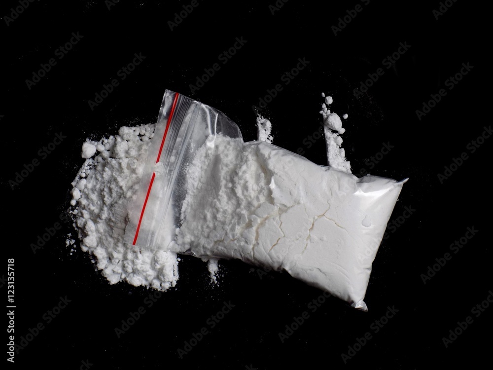 Cocaine drug powder in bag and cocaine powder pile and lines on black ...