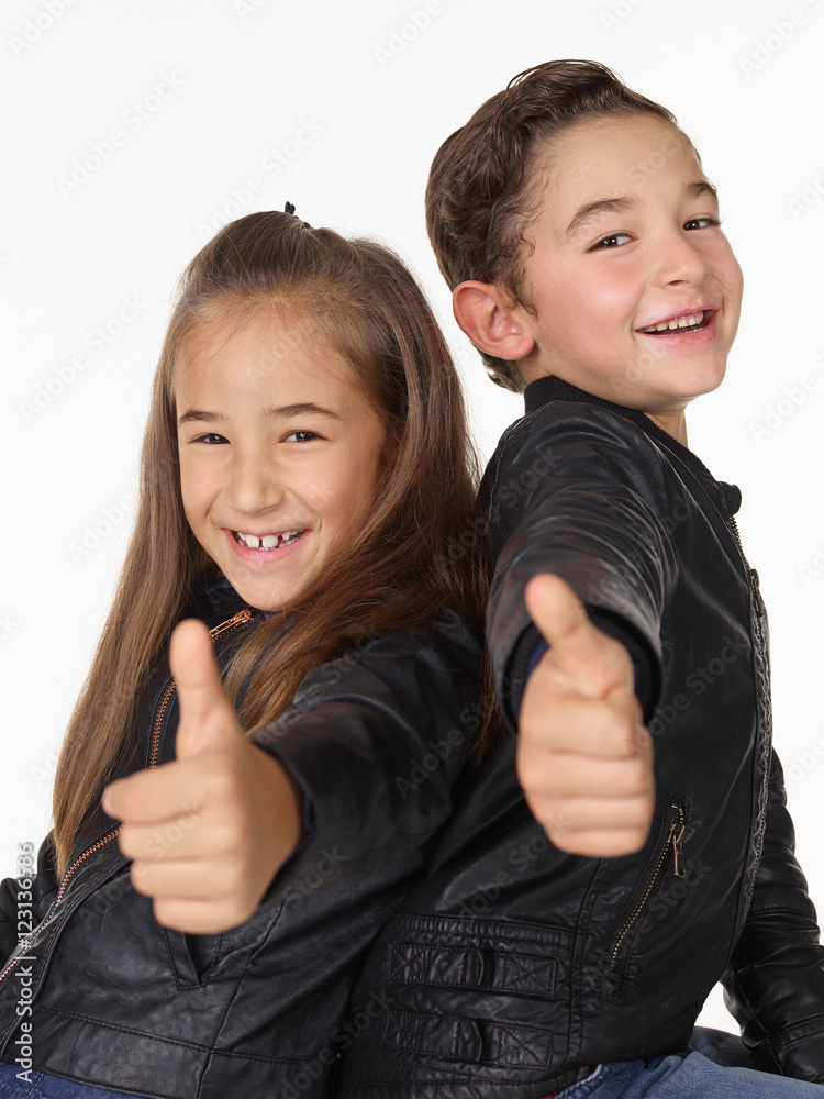 Non-identical twins show thumbs up Stock Photo | Adobe Stock