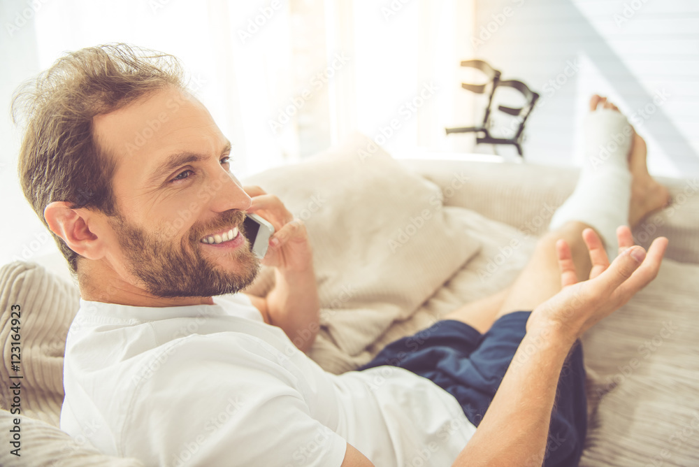 Man with broken leg Stock Photo | Adobe Stock