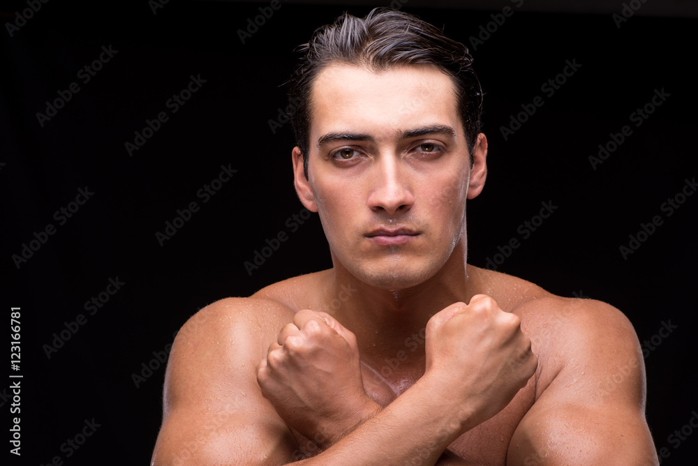 Ripped muscular handsome man on black background Stock Photo | Adobe Stock