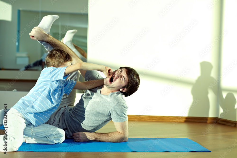 Little boy fighting with his father in gym Stock Photo | Adobe Stock