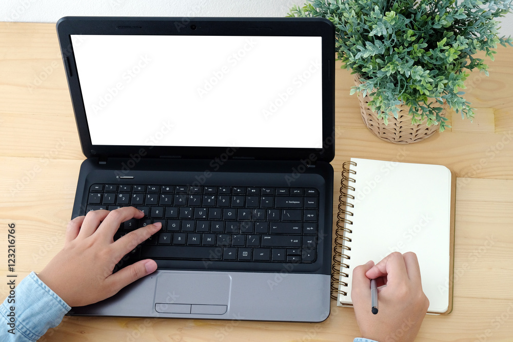 Hand typing laptop with blank screen and blank note paper Stock Photo ...