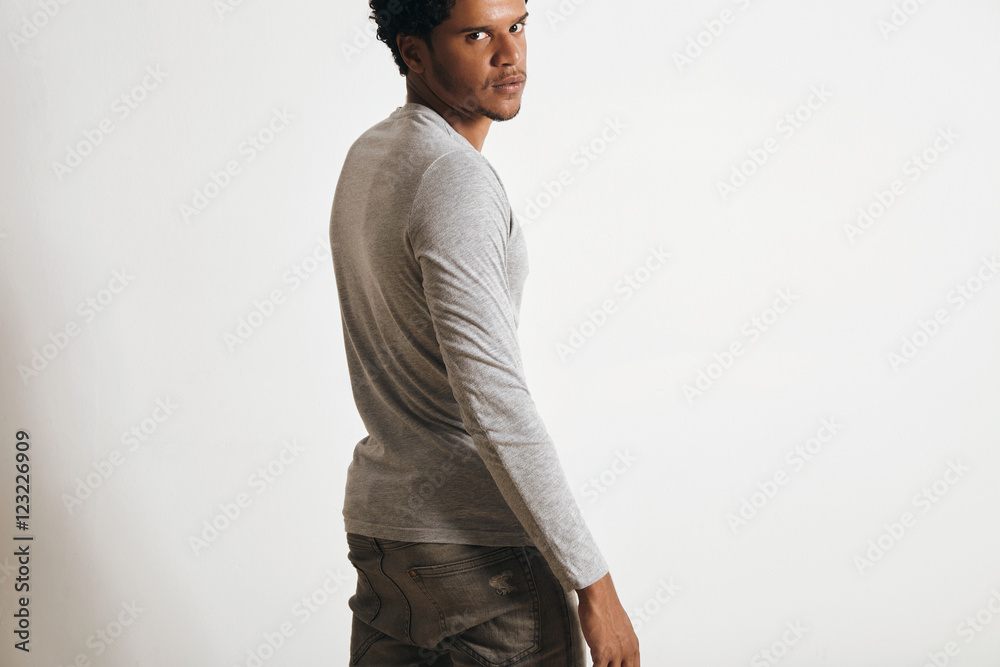 Back view of attractive latino man looking in camera turning around ... Back view of attractive latino man looking in camera turning around ...