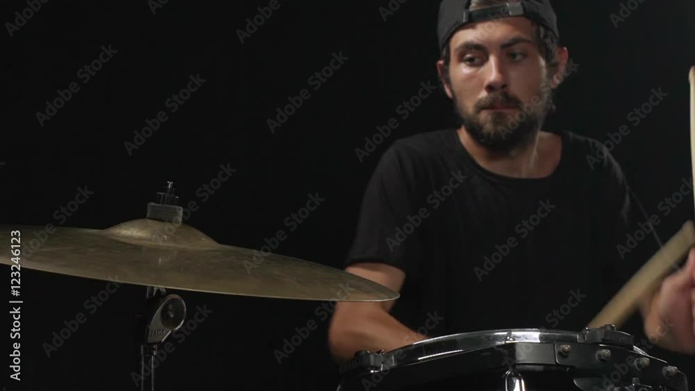 Guy playing on drums over black background Slow motion Stock Video ...