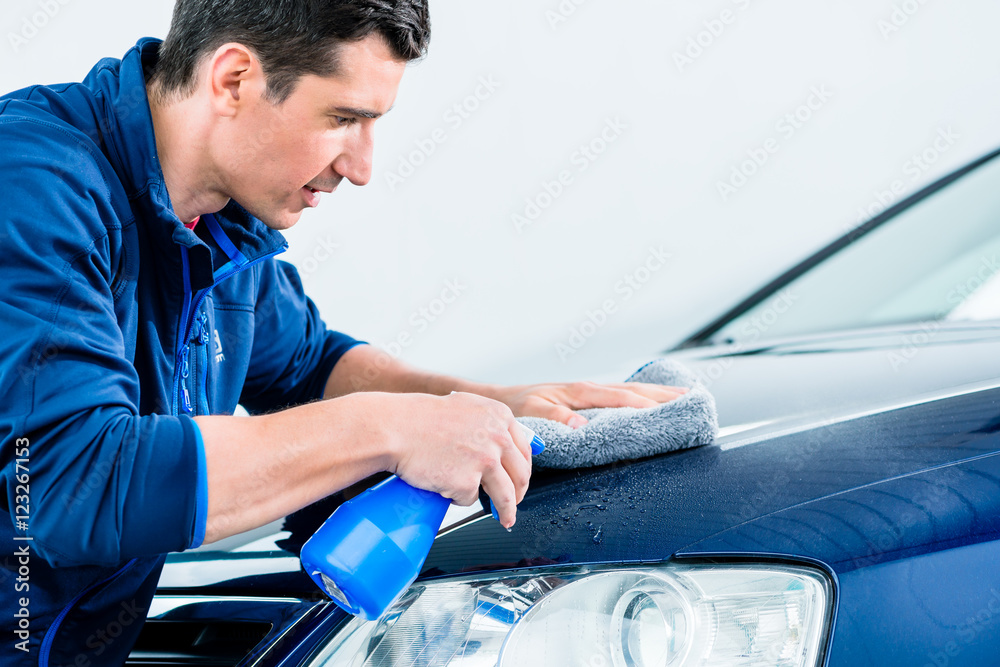 Proud car owner cleaning his vehicle Stock 写真 | Adobe Stock