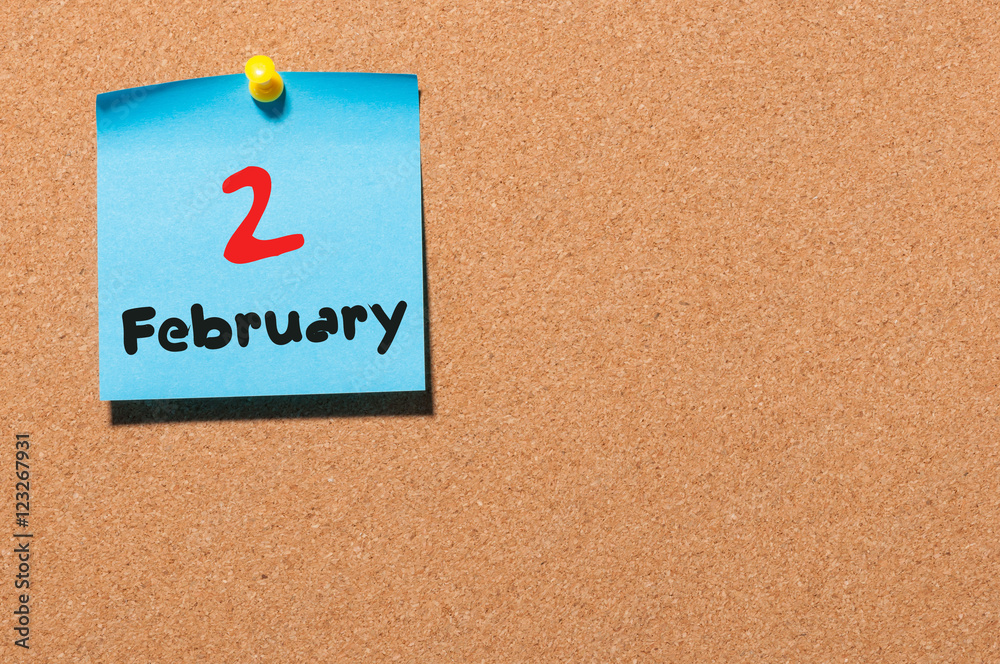 February 2nd. Day 2 of month, calendar on cork notice board background ...