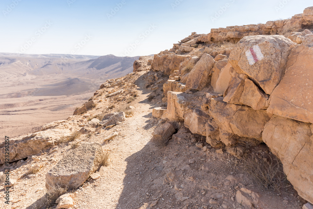 trail edge desert rock marking sign crater stone. Stock Photo | Adobe Stock