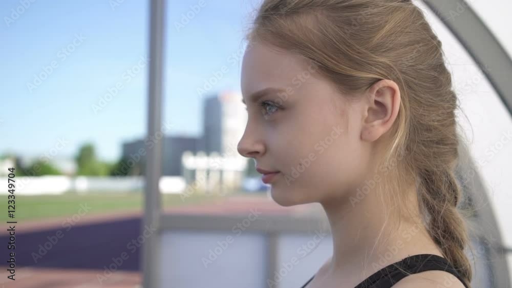 Young woman looking into the distance. Close-up of face Stock Video ...