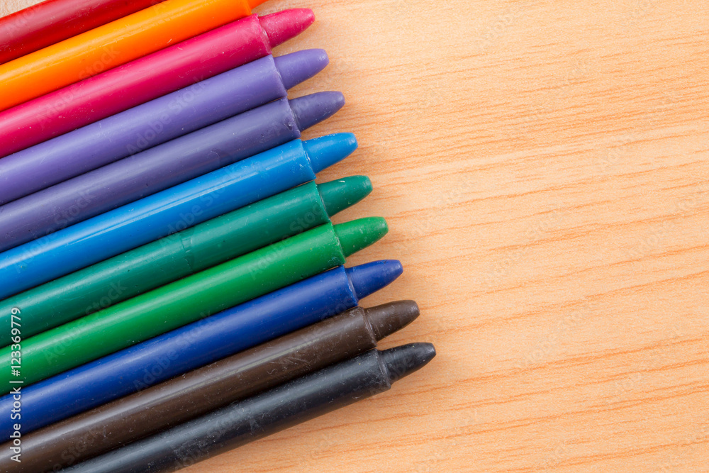 crayon colors on wood background with copy space Stock Photo | Adobe Stock