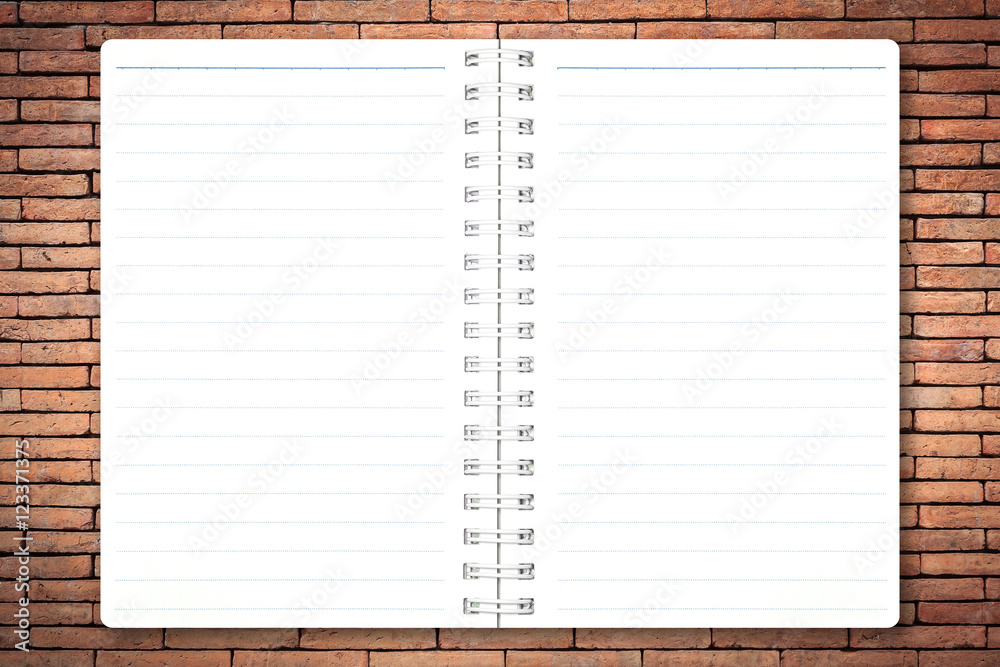 Open notebook paper page with line on brick wall background for design ...