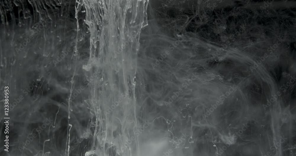 White Ink Effect In Water Filmed On Black Background. Abstract ink ...