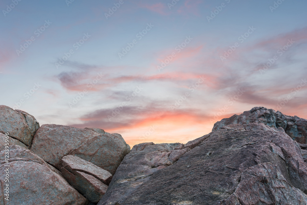 Pile of rocks boulders on sunset sky background Stock Photo | Adobe Stock