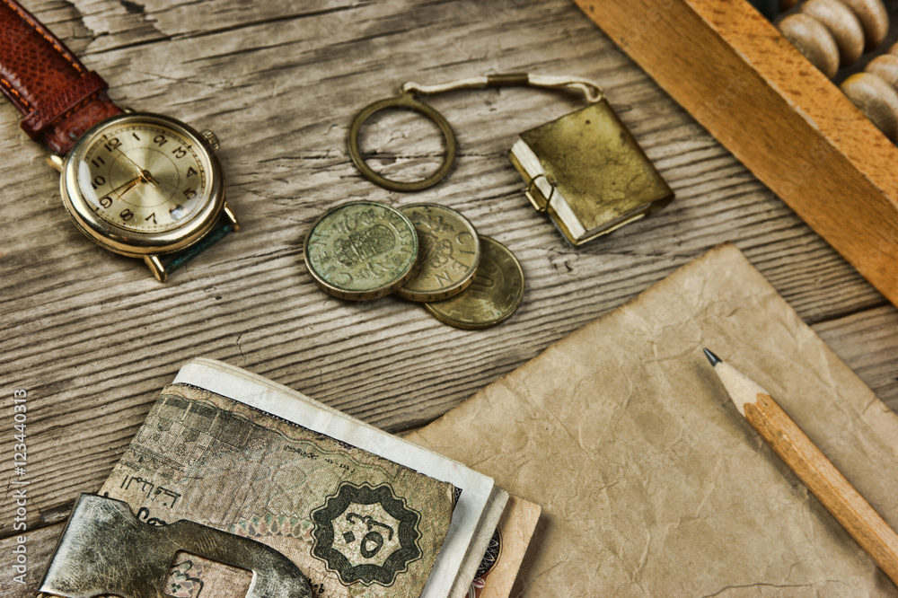 Old notes and coins and abacus on a wooden table Stock Photo | Adobe Stock