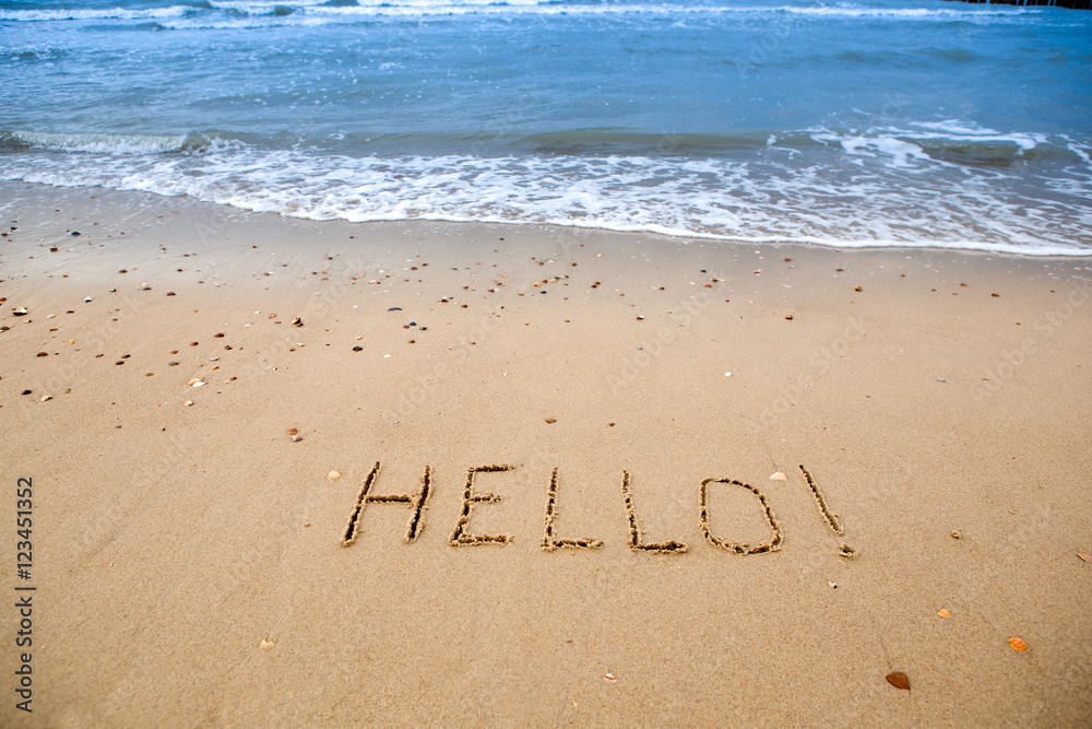 hello, written in the sand at the beach Stock Photo | Adobe Stock