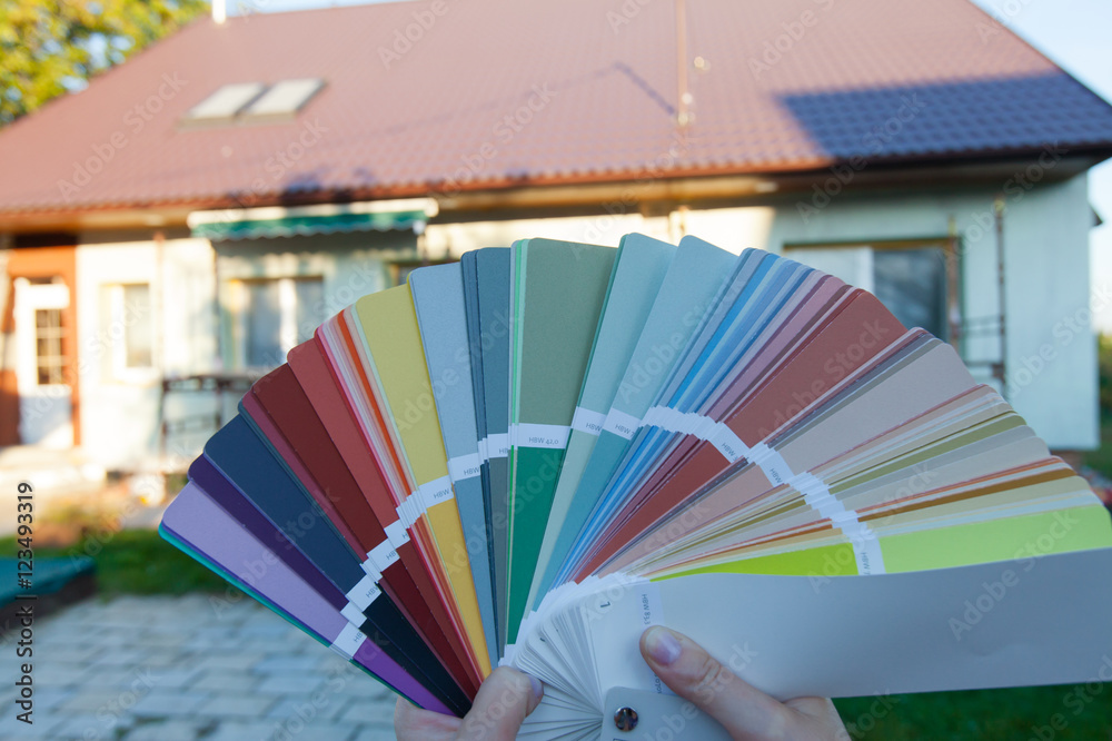 Choosing a new color of the facade. Stock Photo | Adobe Stock