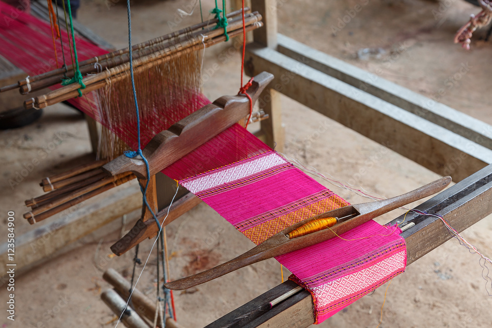 Close up loom with brown yarn and pink silk and Bobbin thread up Stock ...