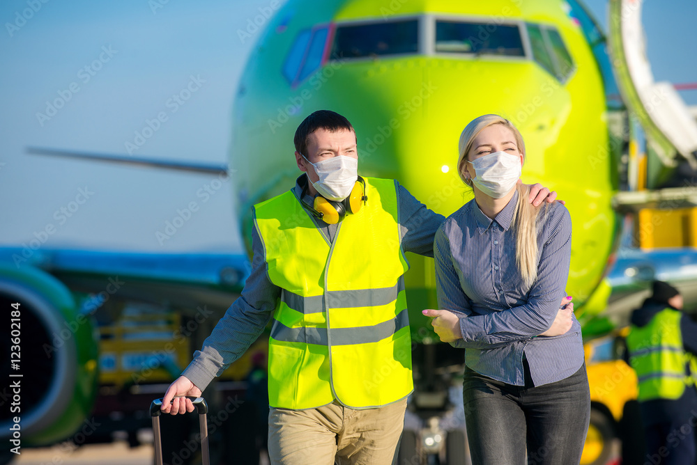 Foto Stock Sick passenger at an airport | Adobe Stock
