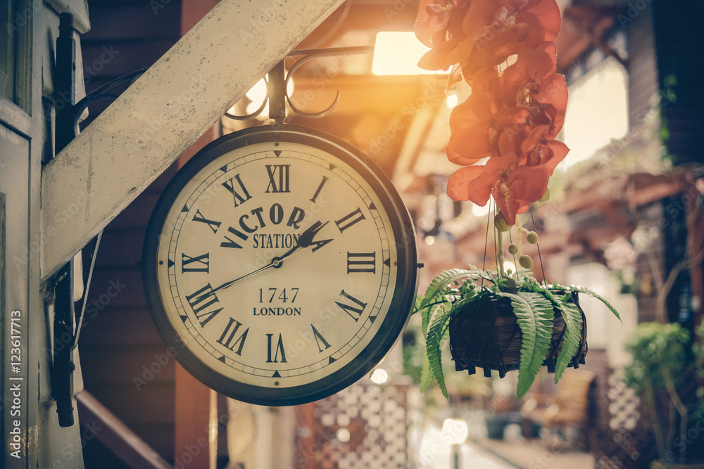 classic clock in the old town background Stock Photo | Adobe Stock