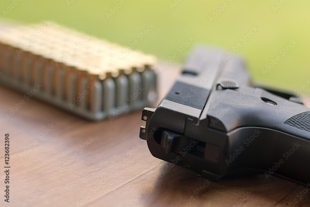 Gun with bullets. Handgun box with new ammunition. Stock Photo | Adobe ...