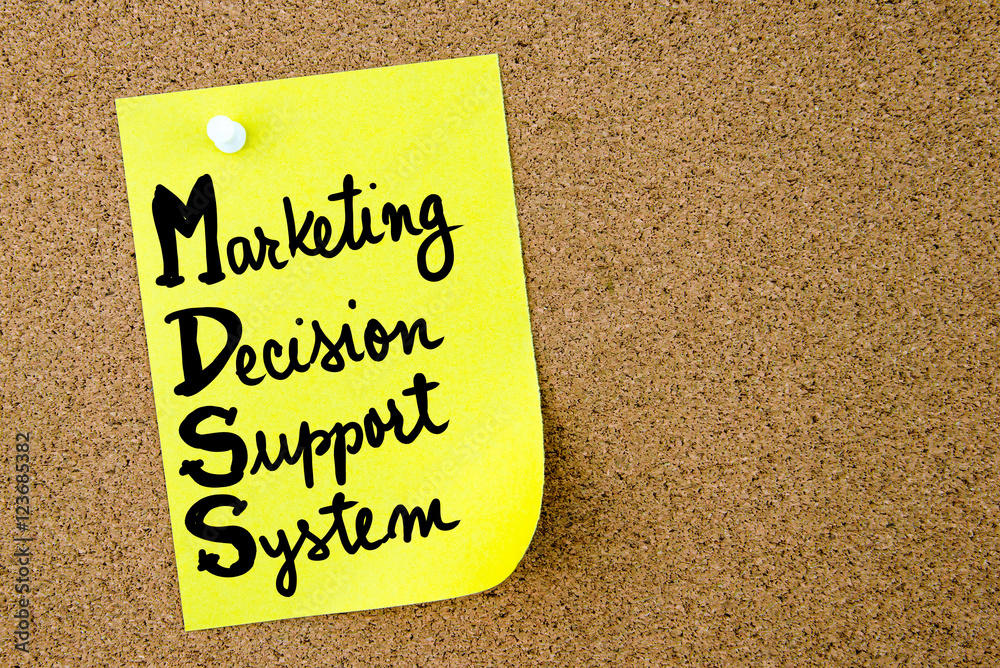 MDSS Marketing Decision Support System written on yellow paper note ...