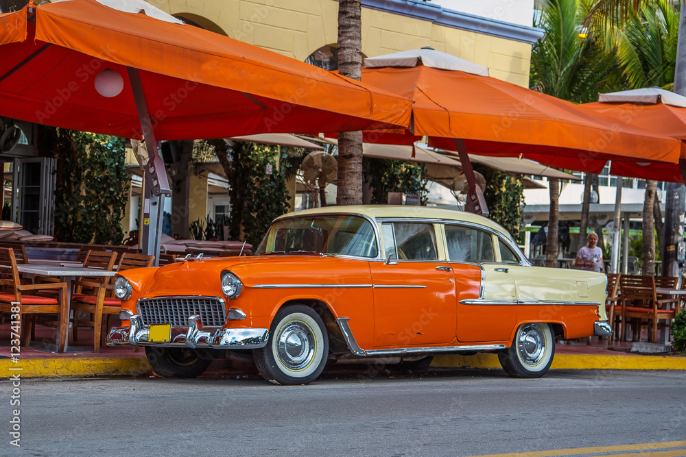 Vintage orange car parked at Ocean Drive in Miami Beach, Florida Stock ...
