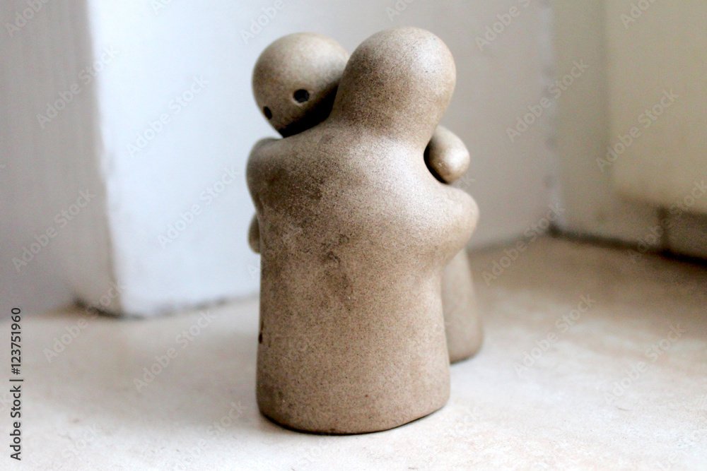 Ceramic people hugging Stock Photo | Adobe Stock